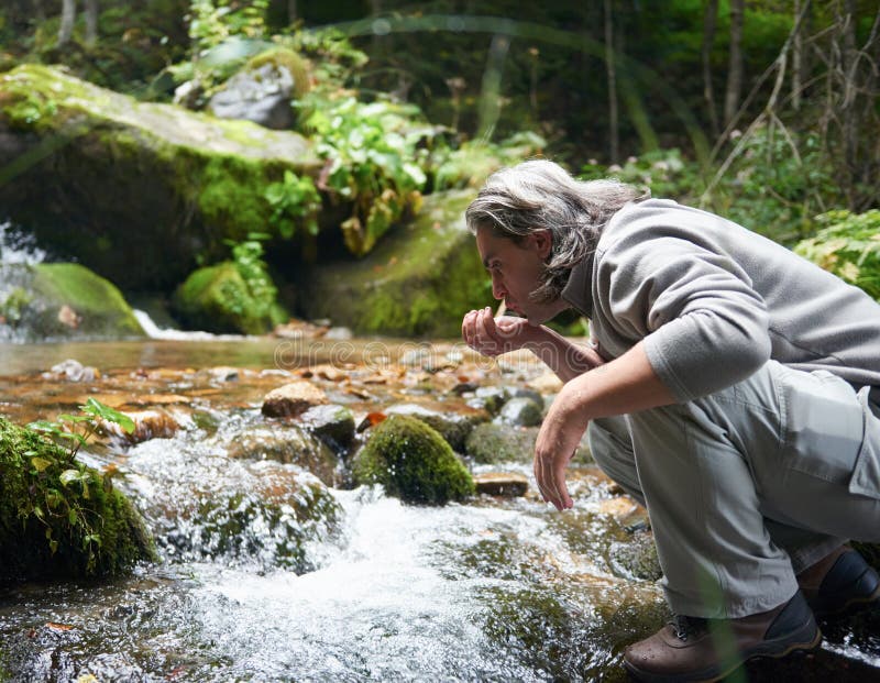Man Drinking Fresh Water From Spring Stock Image - Image of natural ...