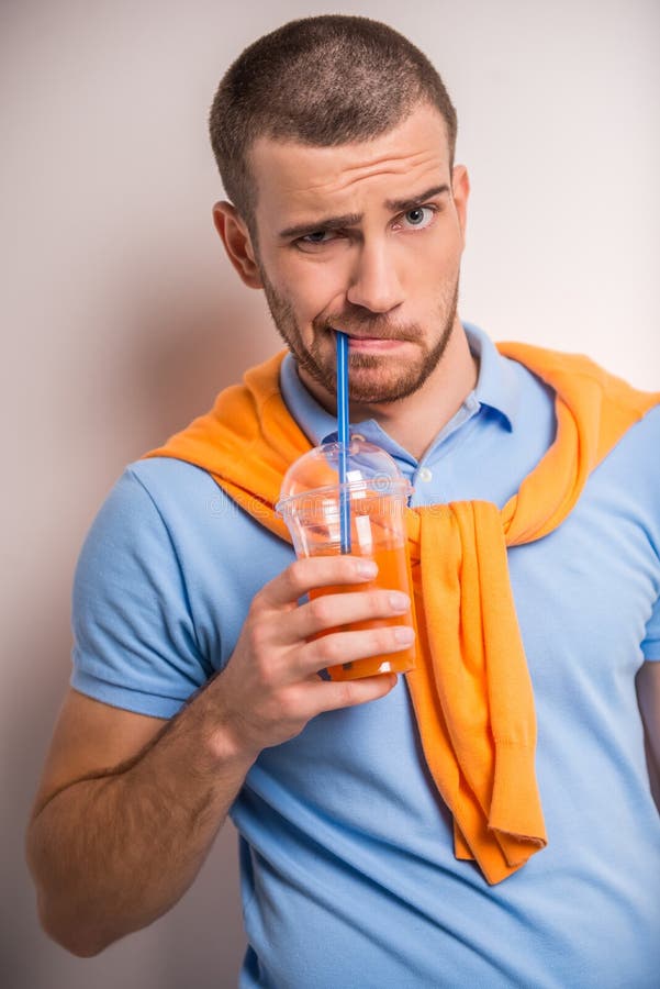 Young Man with a Fruit Juice Stock Photo - Image of closeup, adult ...