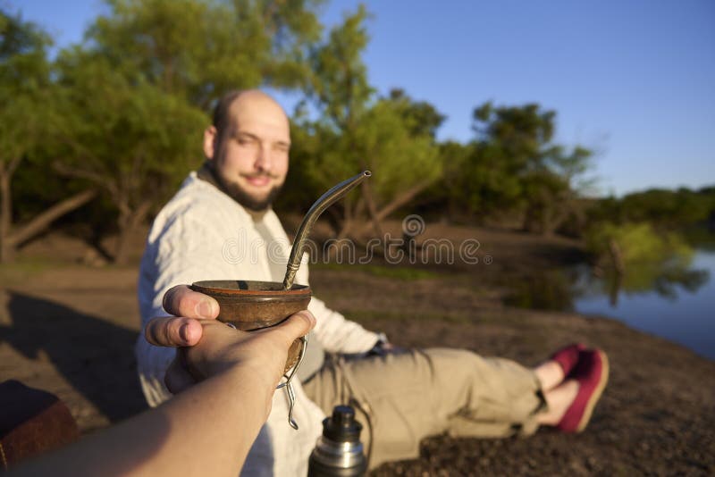 Man Drinking Mate with Someone. this Argentinian Infusion is a Symbol ...