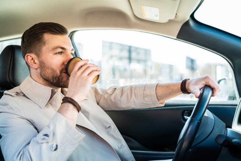 Man Drinking Morning Coffee while Driving Car. Stock Photo - Image of ...