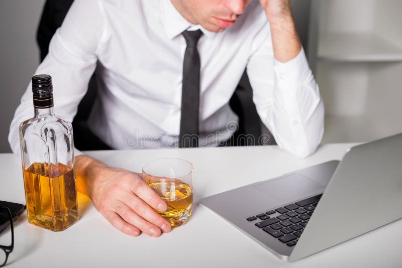 Man drinking at the office stock photo. Image of hangover - 69347554