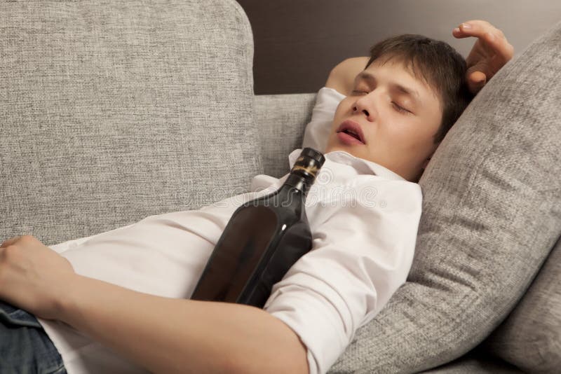 A Man with a Drinking Problem is Relaxing on a Sofa Stock Image - Image ...
