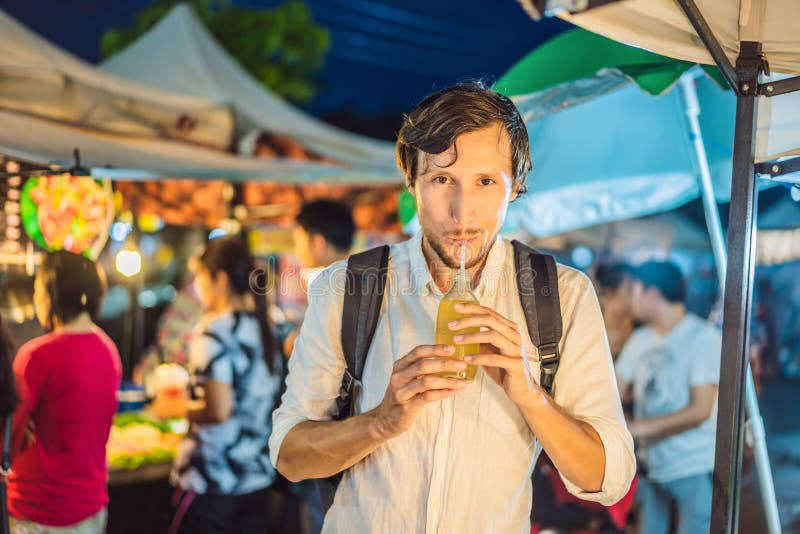 Man Drinking Sugar Cane Juice on the Asian Market Stock Photo - Image ...