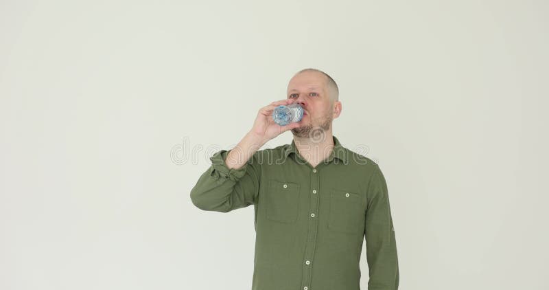 Man Drinking Water from a Bottle on a White Background Stock Video ...