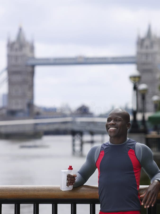 Man Drinking Water in Front of Tower Bridge England London Stock Image ...