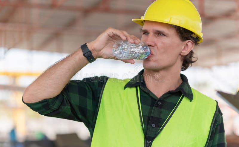 Man Drinking Water at the Precast Factory Site, Engineer Man Drinking ...