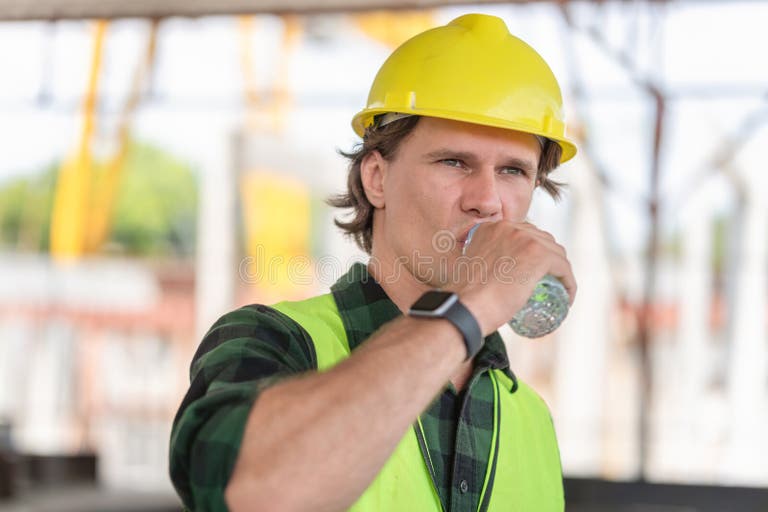 Man Drinking Water at the Precast Factory Site, Engineer Man Drinking ...