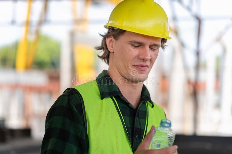 Man Drinking Water at the Precast Factory Site, Engineer Man Drinking ...