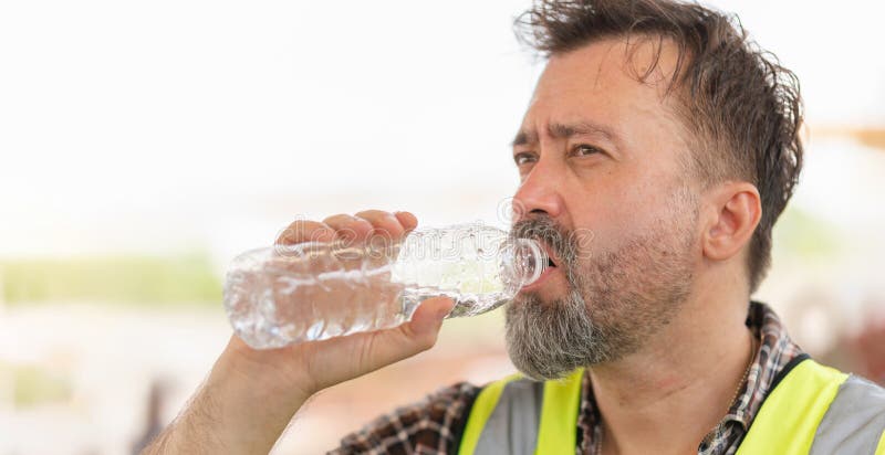 Man Drinking Water at the Precast Factory Site, Engineer Man Drinking ...