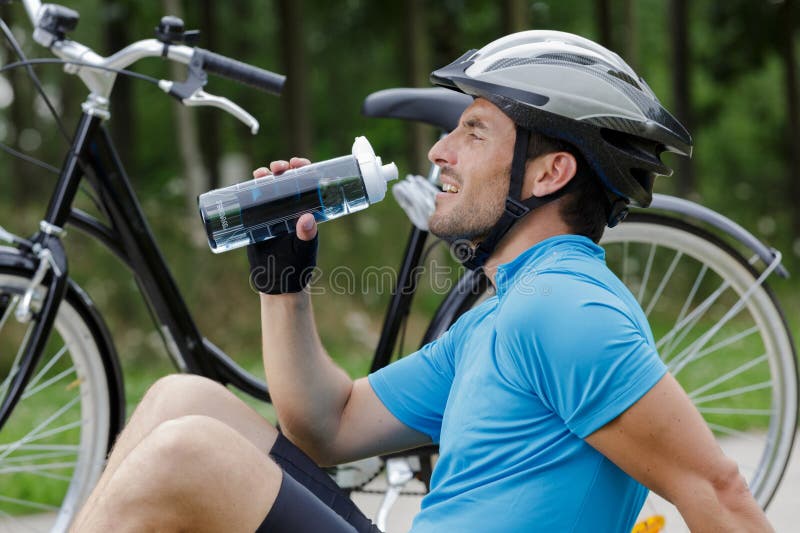 Man Drinking Water while Taking Rest for Cycling Stock Photo - Image of ...