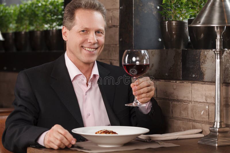 Man Drinking Wine. Portrait of Cheerful Businessman Drinking Stock ...