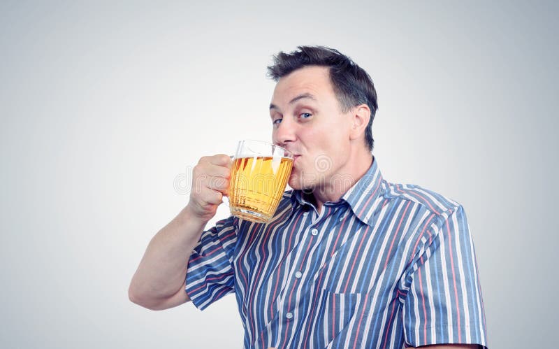 Man drinks beer from a mug stock image. Image of adult - 58409293