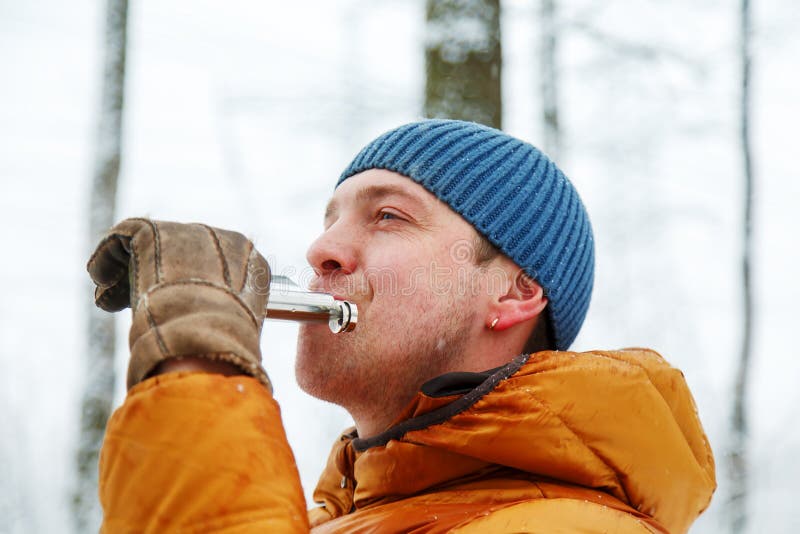 Man drinks from a flask. stock image. Image of relationship - 84648103