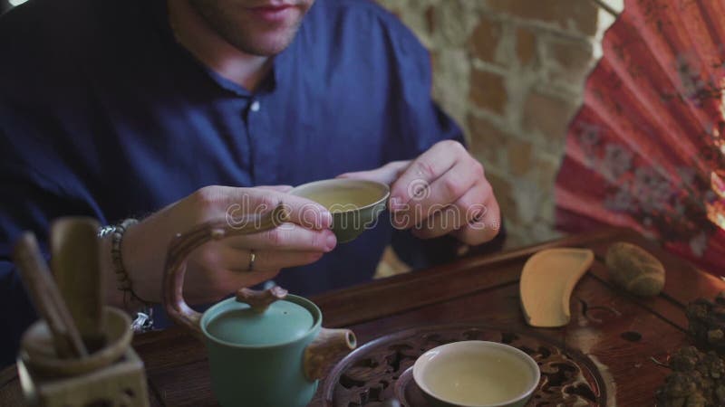 A Man Drinks Green Tea from a Tea Set in a Tea Room Stock Footage ...