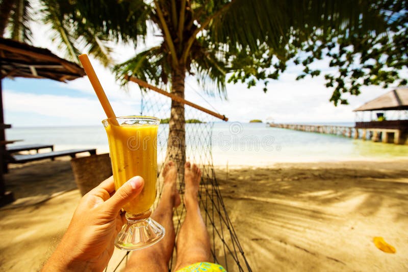 Man Drinks Mango Juice on the Beach Stock Photo - Image of vacation ...