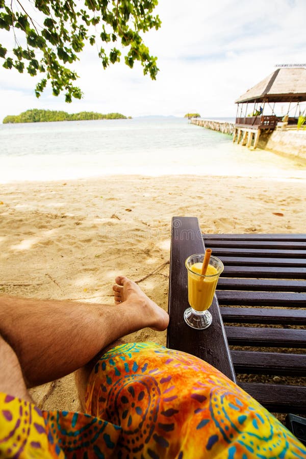 Man Drinks Mango Juice on the Beach Stock Photo - Image of drink, mango ...