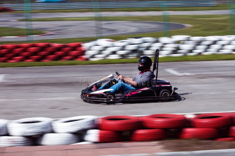 Man drive go kart on track stock photo. Image of outdoor - 92620132