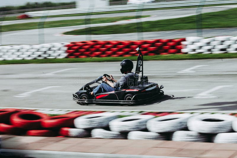 Man drive go kart on track stock image. Image of auto - 92620239