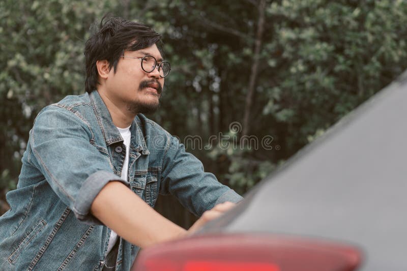 Man Driver is Pushing His Car after Car Breakdown. Stock Image - Image ... Man Driver is Pushing His Car after Car Breakdown. Stock Image - Image ...