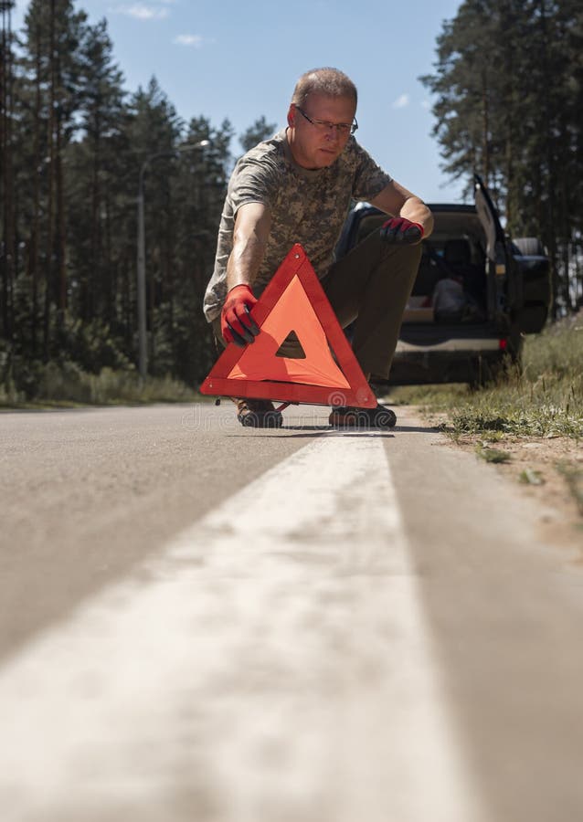 Man Driver Putting and Setting Red Triangle Caution Warning Sign on ...