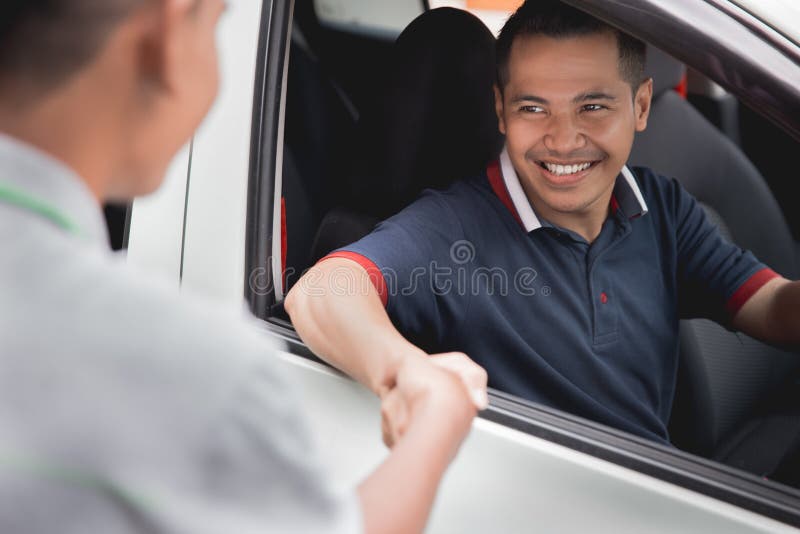 Man driver shake hand stock photo. Image of consumer - 110804310