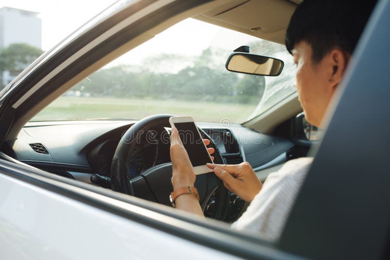 Man Driver Using Smart Phone in Car Stock Image - Image of driving ...