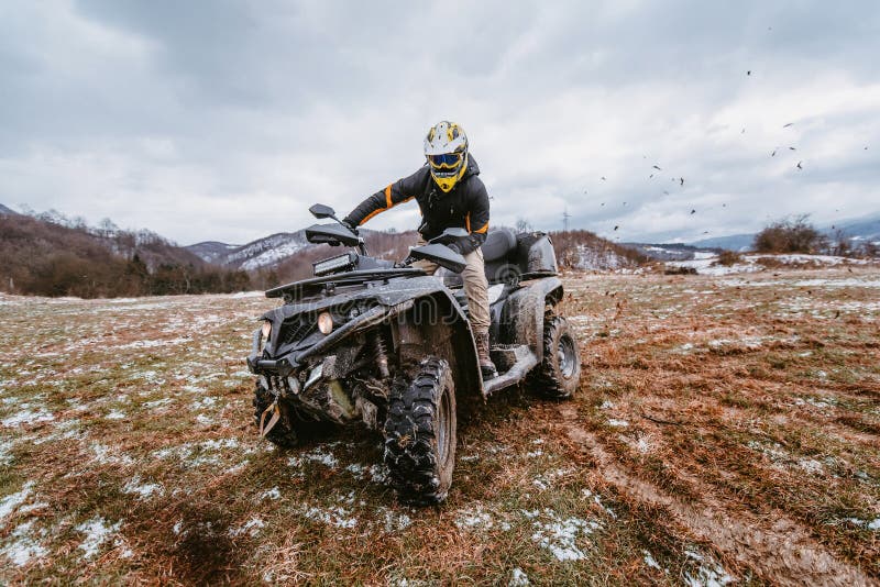 A Man Drives an ATV in the Mud. Drift Driving an ATV Quad in Mud and ...