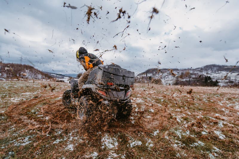A Man Drives an ATV in the Mud. Drift Driving an ATV Quad in Mud and ...