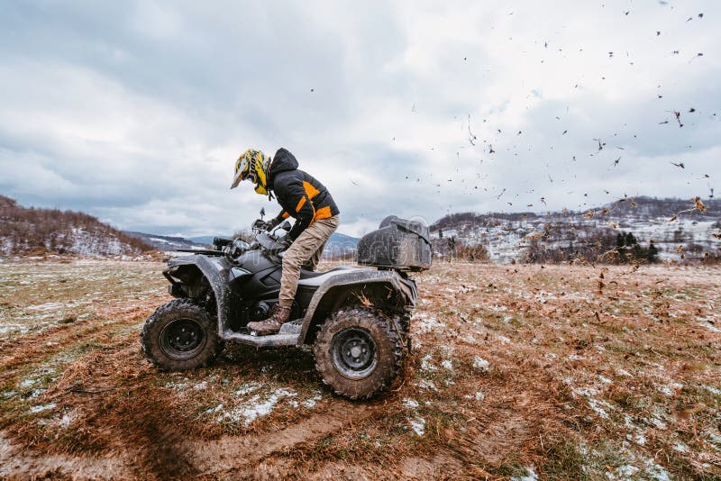 A Man Drives an ATV in the Mud. Drift Driving an ATV Quad in Mud and ...