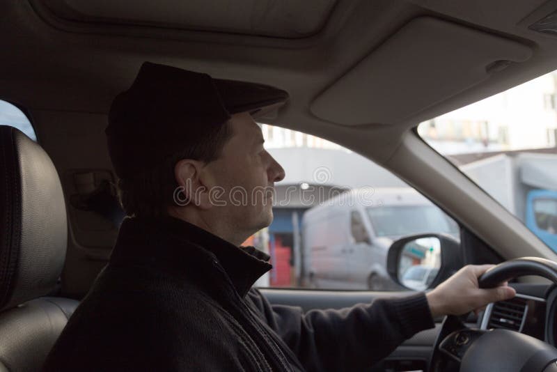 A Man Drives a Car Around the City Stock Photo - Image of interior ...