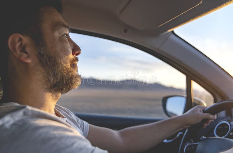 Man Driving a Car. Beautiful Nature and Mountains at Sunset in Side ...