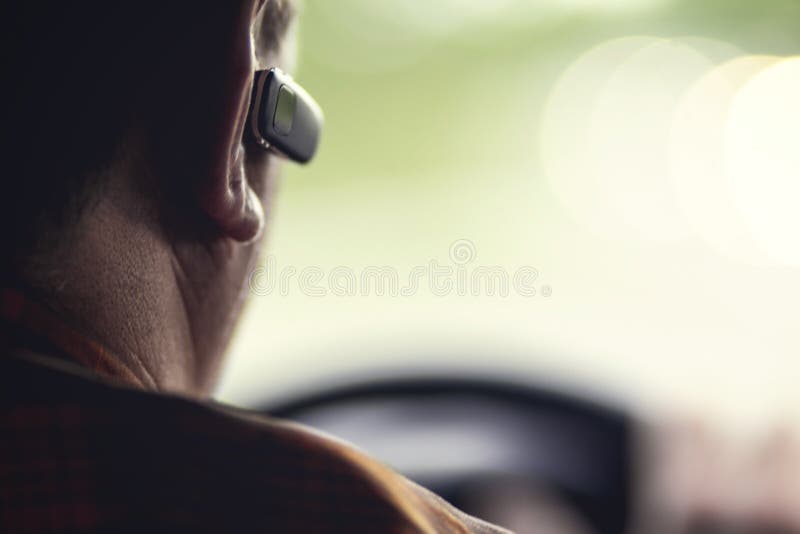 Man Driving a Car with a Bluetooth Stock Photo - Image of hands, road ...