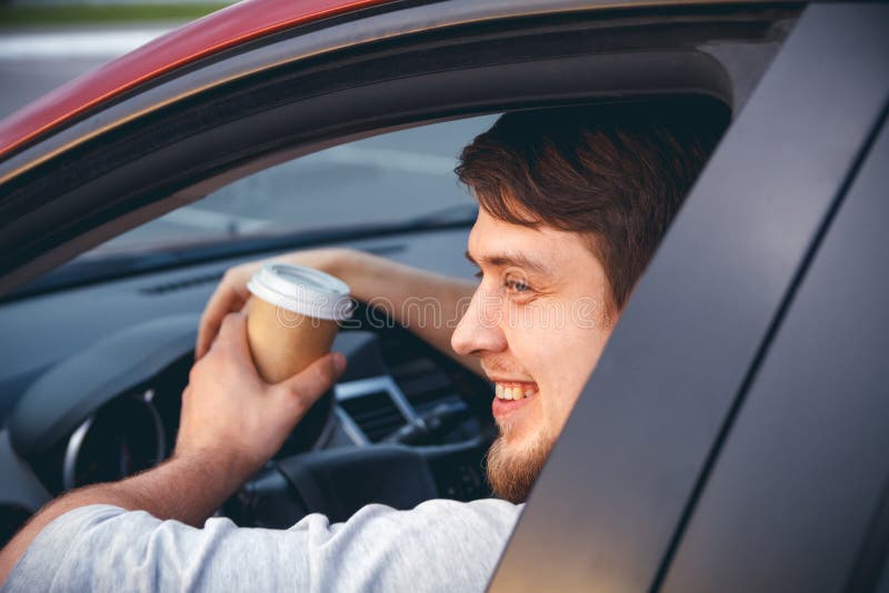 A Man Driving a Car Drinking Coffee Stock Image - Image of male ...