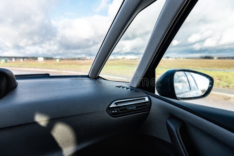 A Man Driving a Car with a Front View of the Road Stock Photo - Image ...