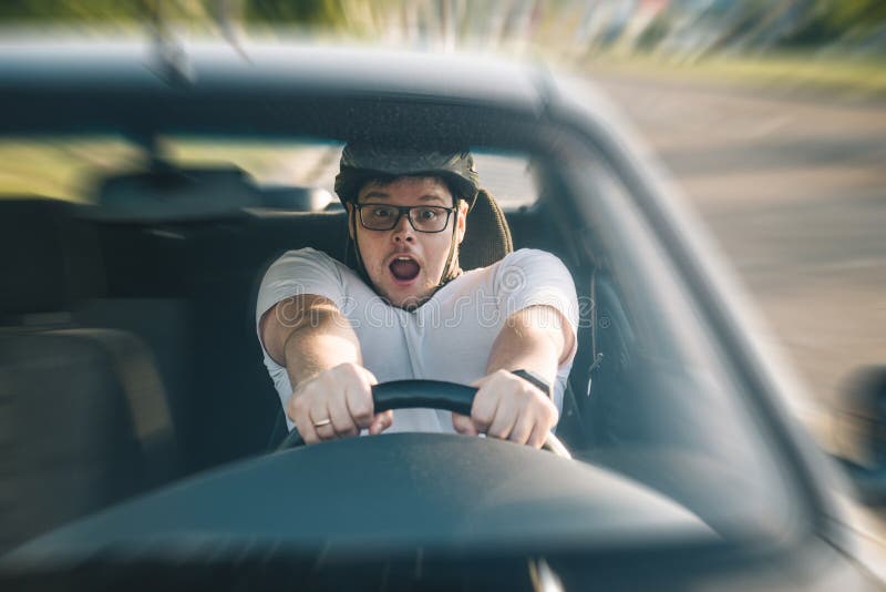 Man Driving Car in Helmet with Horror on Her Face Stock Image - Image ...