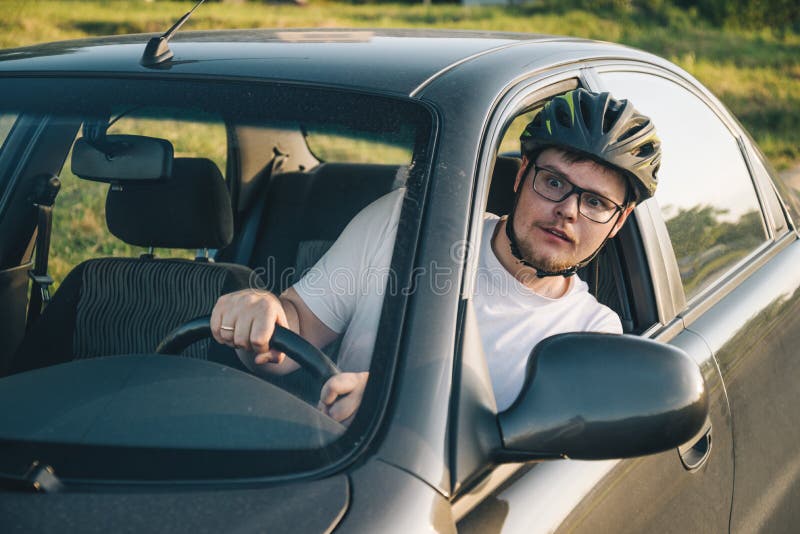 Man Driving Car in Helmet with Horror on Her Face Stock Image - Image ...