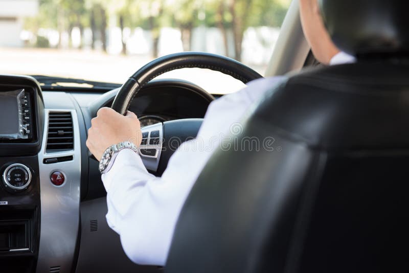 Man Driving a Car and Looking at Watch Stock Image - Image of control ...