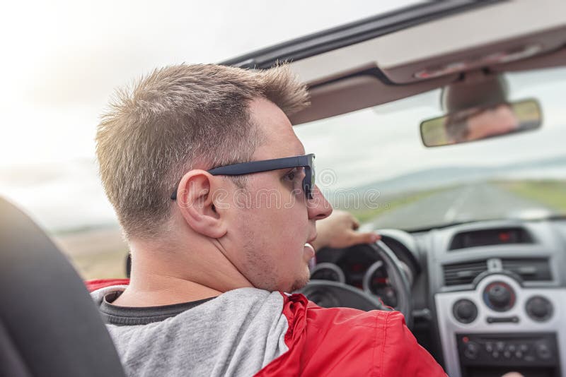 A Man Driving a Car Rushes Along the Highway. Stock Image - Image of ...