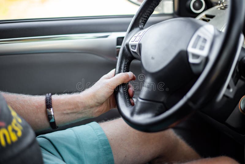 A Man is Driving a Car. Side View from Inside the Car Stock Image ...