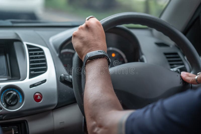 A Man Driving in a Car and Smart Watch in His Hand Stock Image - Image ...