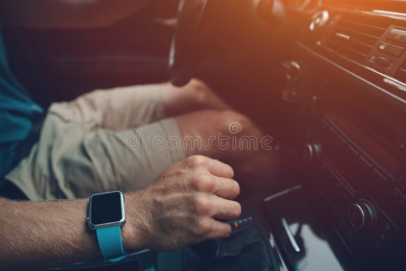 Man Driving a Car at Sunny Day, Smart Watch on His Hand, Inside Stock ...