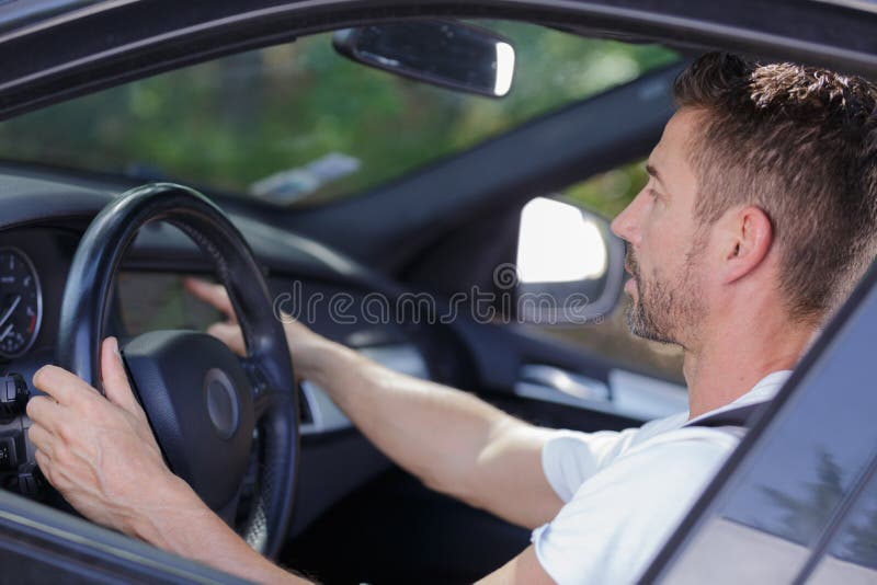 Man Driving Car Using One Hand Stock Photo - Image of speed, showroom ...