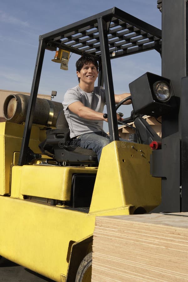 Man Driving Forklift Loader Stock Image - Image of machine, employment ...