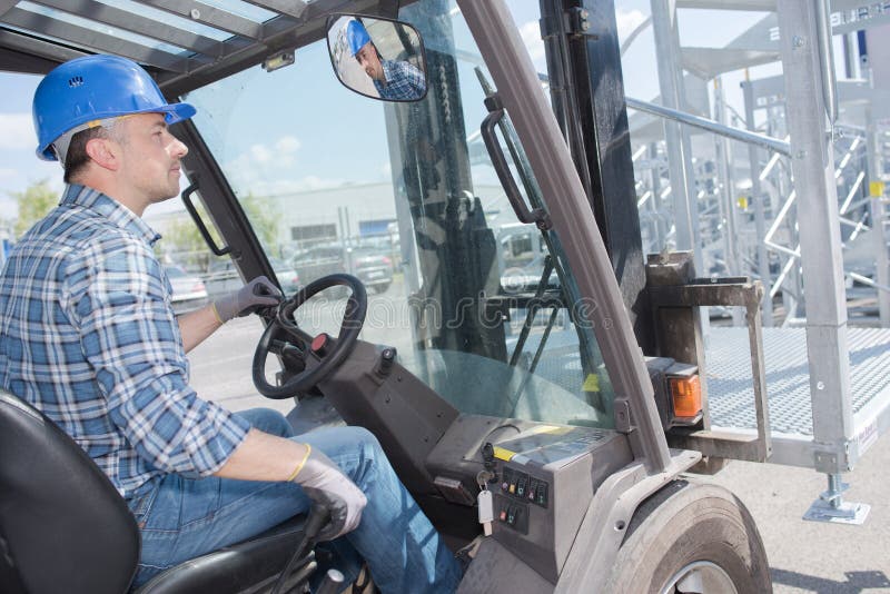 Man driving forklift truck stock photo. Image of carrier - 123598354
