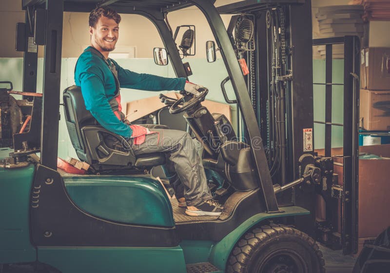 Man driving forklift truck stock image. Image of forklift - 61170349