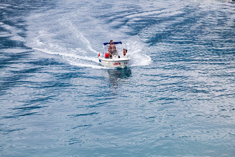 Man Driving a Speed Motor Boat Stock Photo - Image of search, boat ...