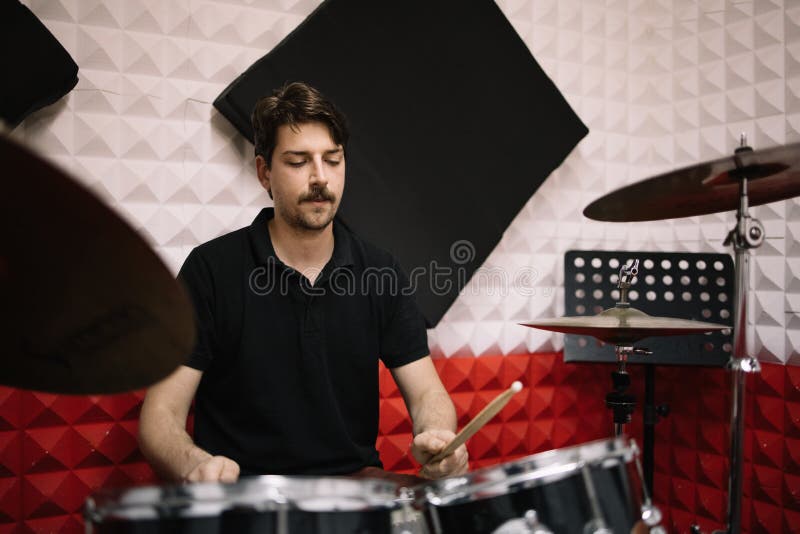 Man Drummer with Drumsticks Playing Drums and Cymbals Stock Photo ...