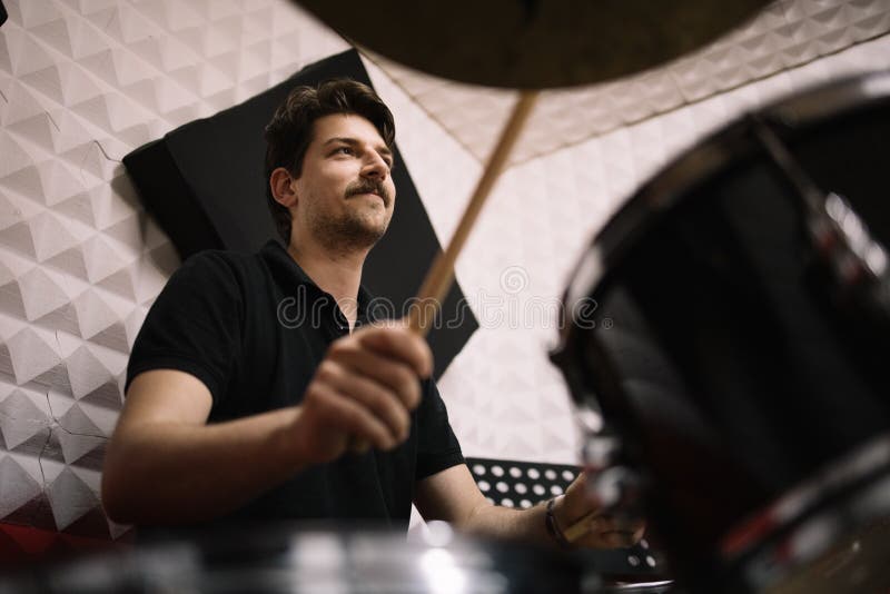 Man Drummer with Drumsticks Playing Drums and Recording in Studio Stock ...