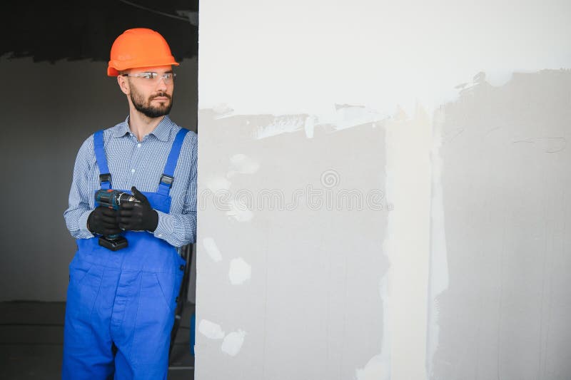 Man Drywall Worker Installing Plasterboard Sheet To Wall Stock Photo ...