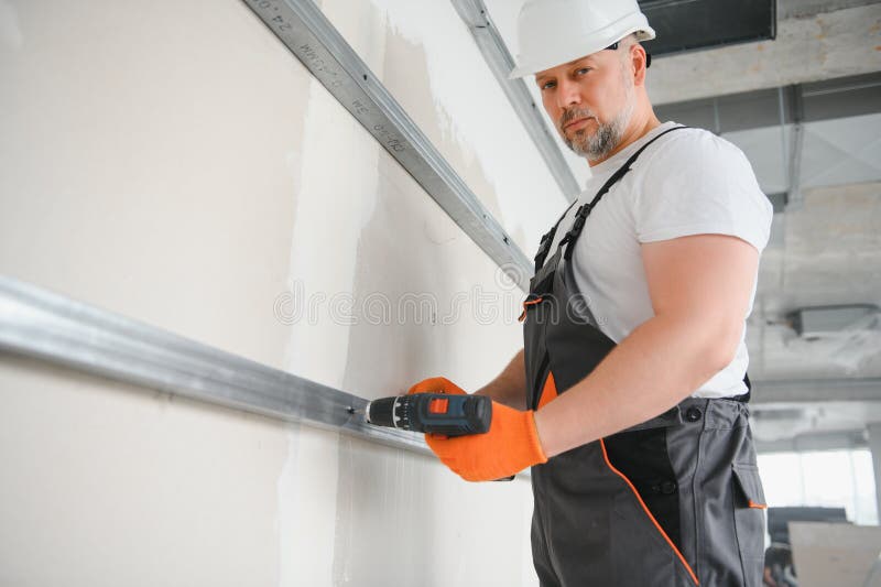 Man Drywall Worker Installing Plasterboard Sheet To Wall Stock Image ...
